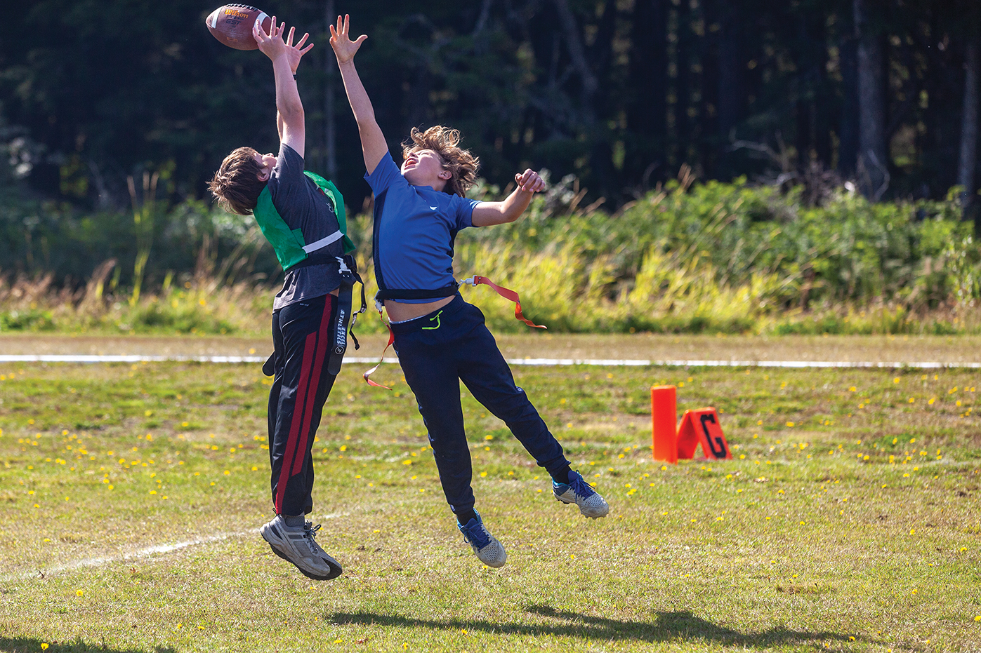 Photos of the week: First day of school, flag football, Tlingít code ...